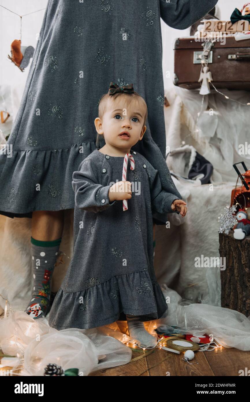 Boxing day, Saint Nicholas Day. Baby girl and mom unpacked boxes with ...