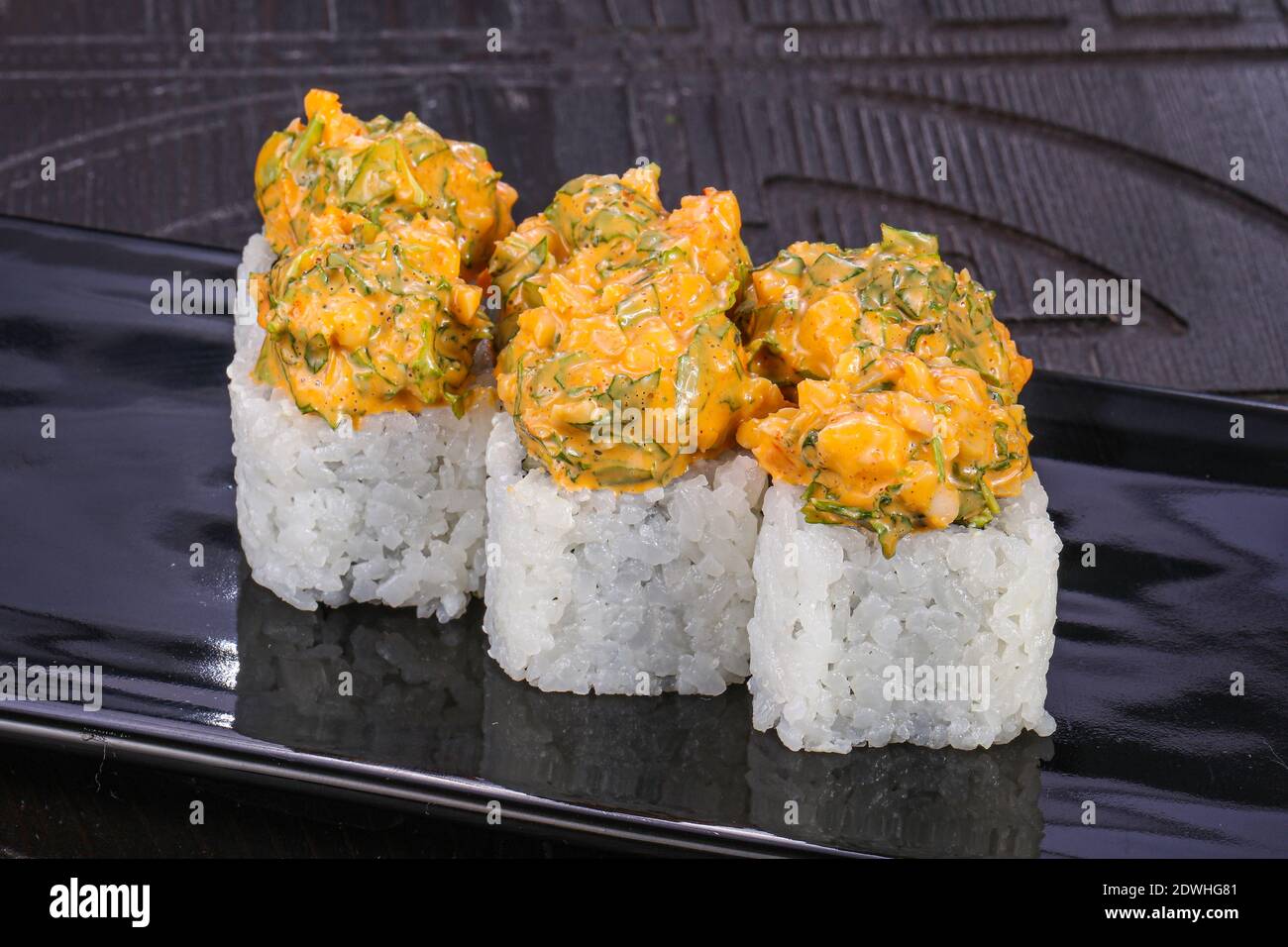 Japanese spicy roll with fish and sauce Stock Photo - Alamy