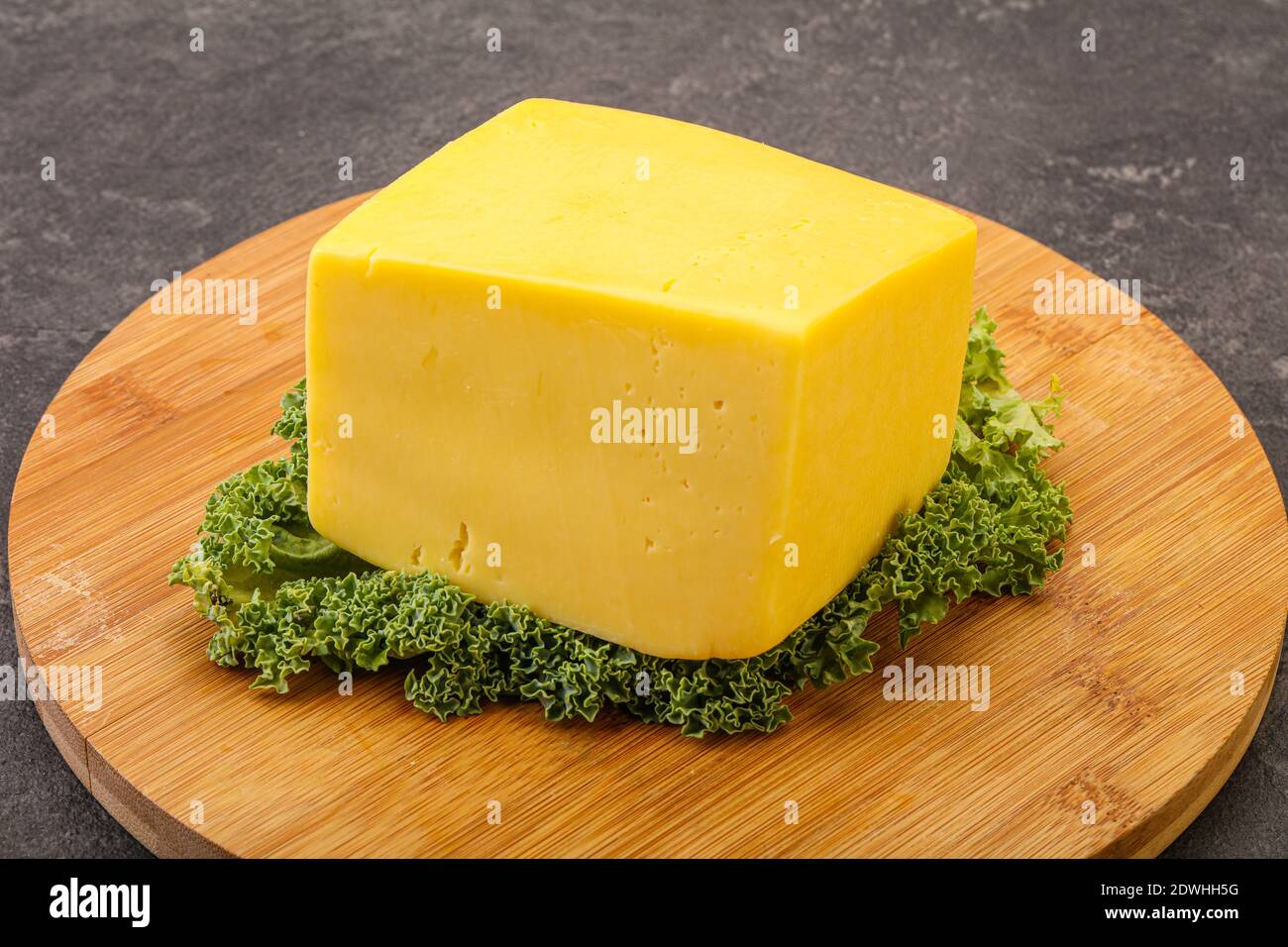 Yellow tilsiter cheese dairy product brick Stock Photo - Alamy