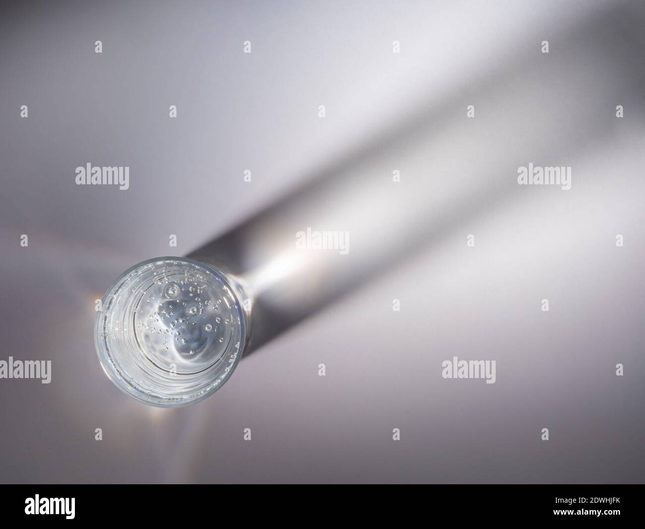 Glass of water seen from above with shadow of glass on background Stock ...