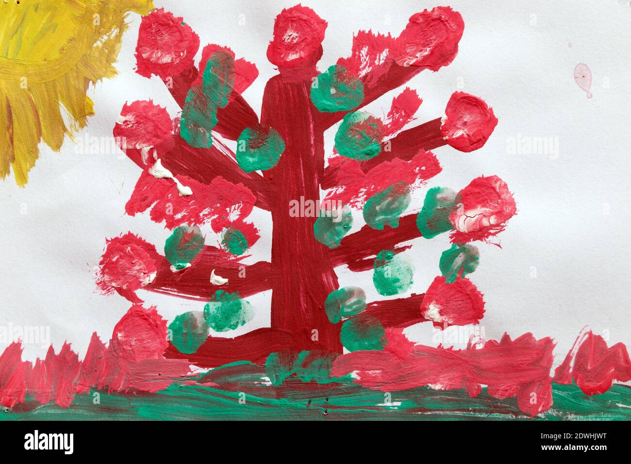 Seven year old child's drawing, red tree in the field, watercolors ...