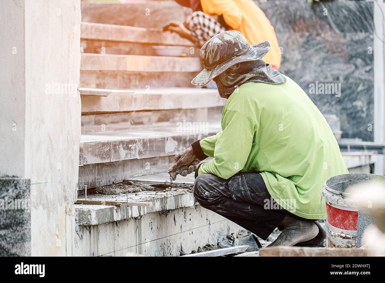 Construction worker working hard in construction site Stock Photo - Alamy