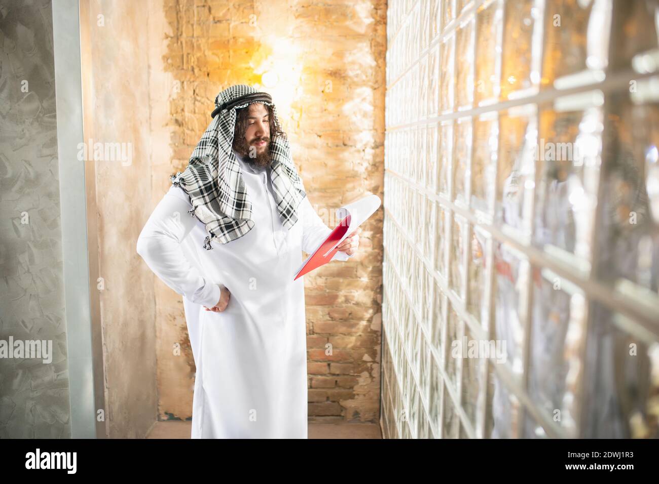 Offers. Arabian businessman working in office, business centre using ...