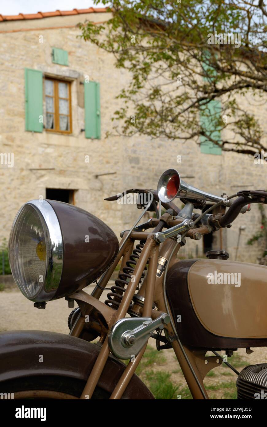 Vintage brown french motorcycle in front of old stoned house Stock ...