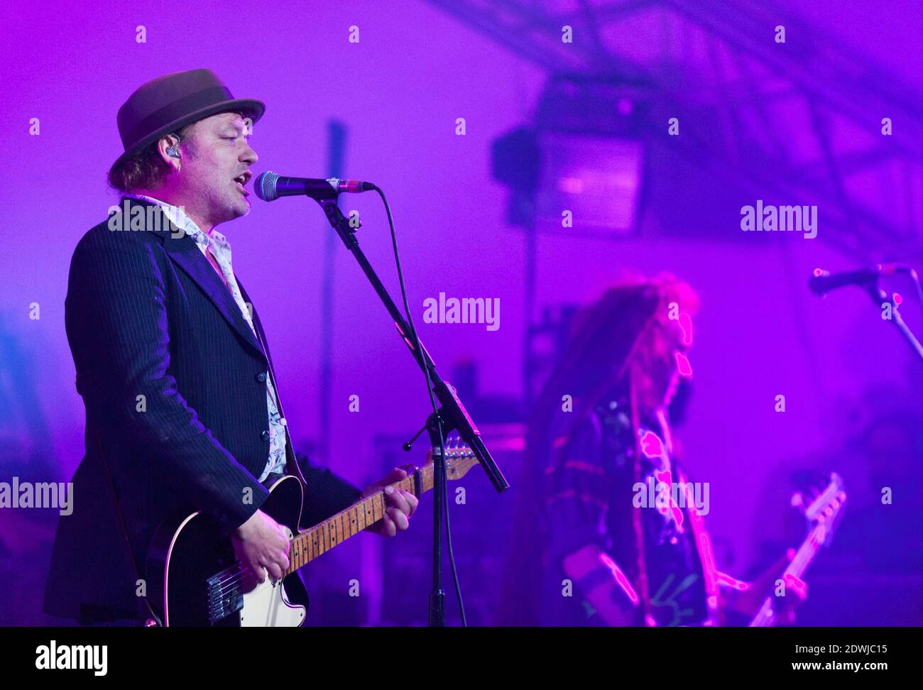 Lead singer and guitarist, Mark Chadwick of The Levellers performing at ...