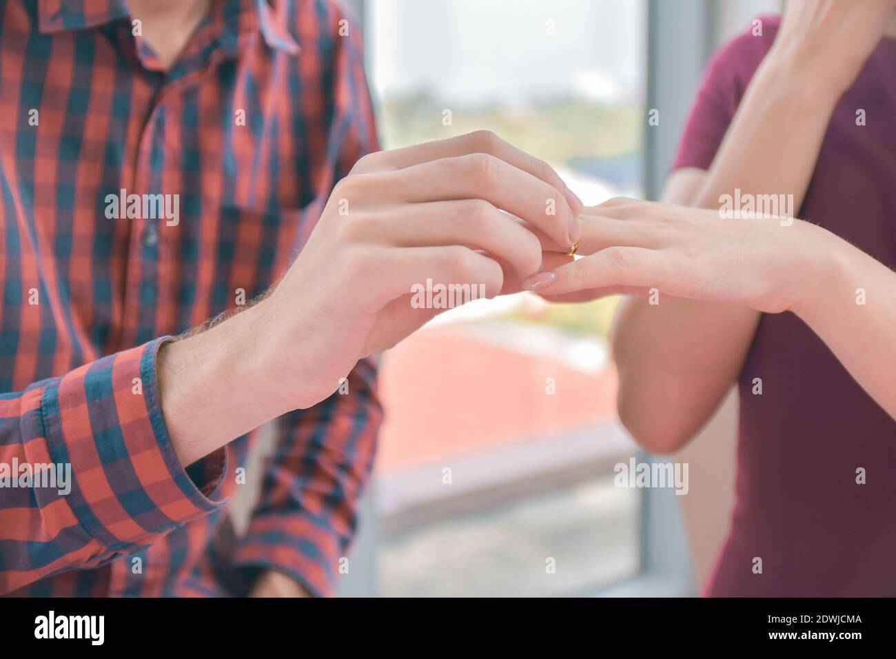 Couples hold hands and propose marriage on the table Stock Photo - Alamy
