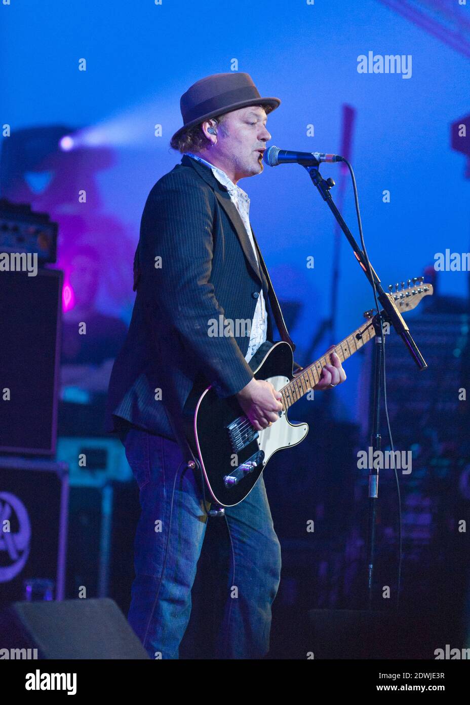 Lead singer and guitarist, Mark Chadwick of The Levellers performing at ...