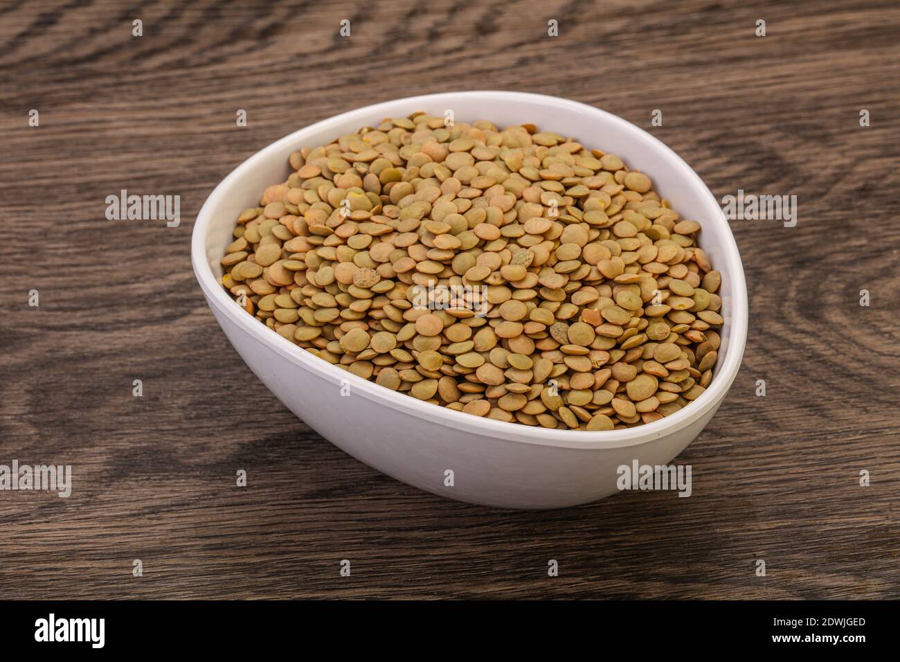 Vegan cuisine - Dry lentil heap isolated Stock Photo - Alamy