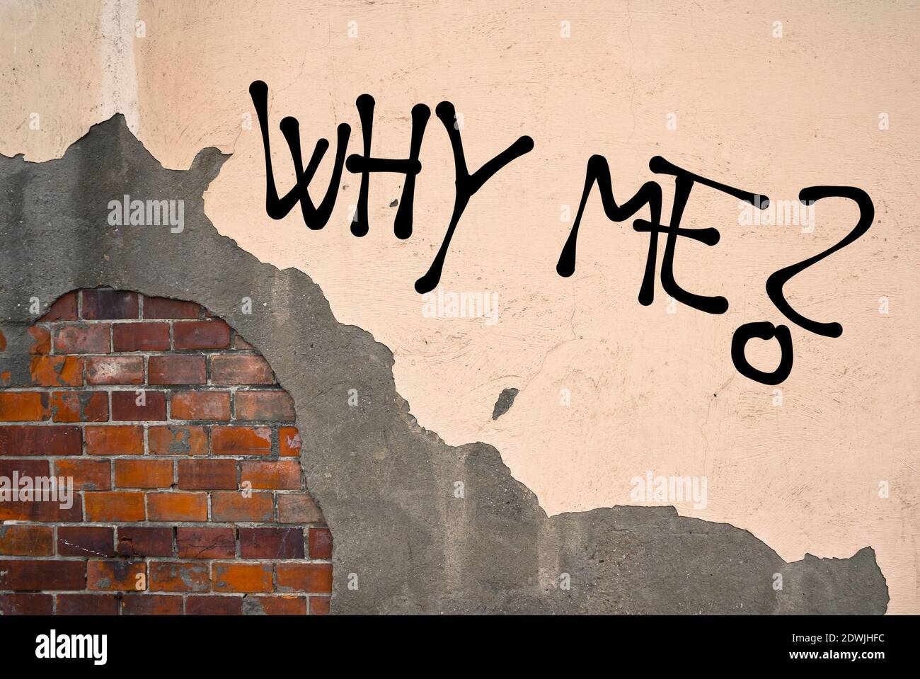 Why Me? - handwritten graffiti sprayed on the wall - innocent sufferer ...