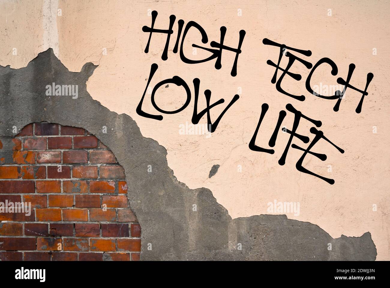 High Tech Low Life - handwritten graffiti sprayed on the wall ...