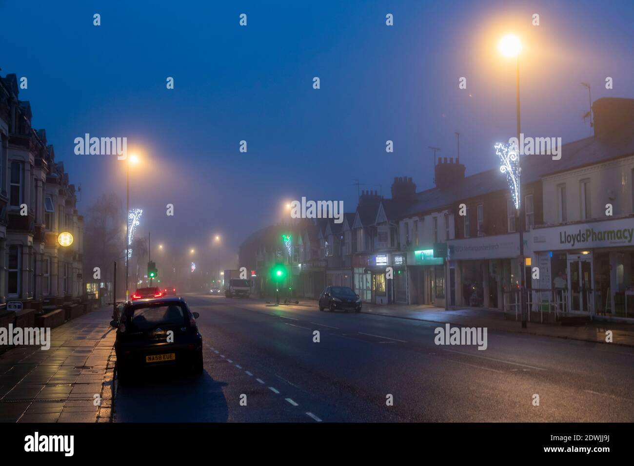 Northampton, UK 23rd December 2020. Mist and drizzle on a quiet early ...