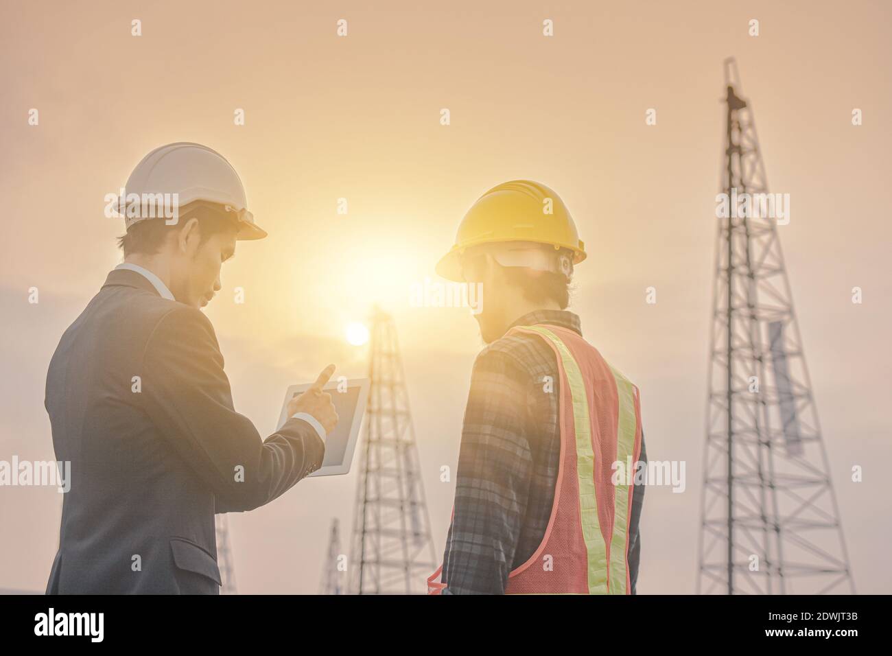 Project manager and Engineer standing communication at workplace ...