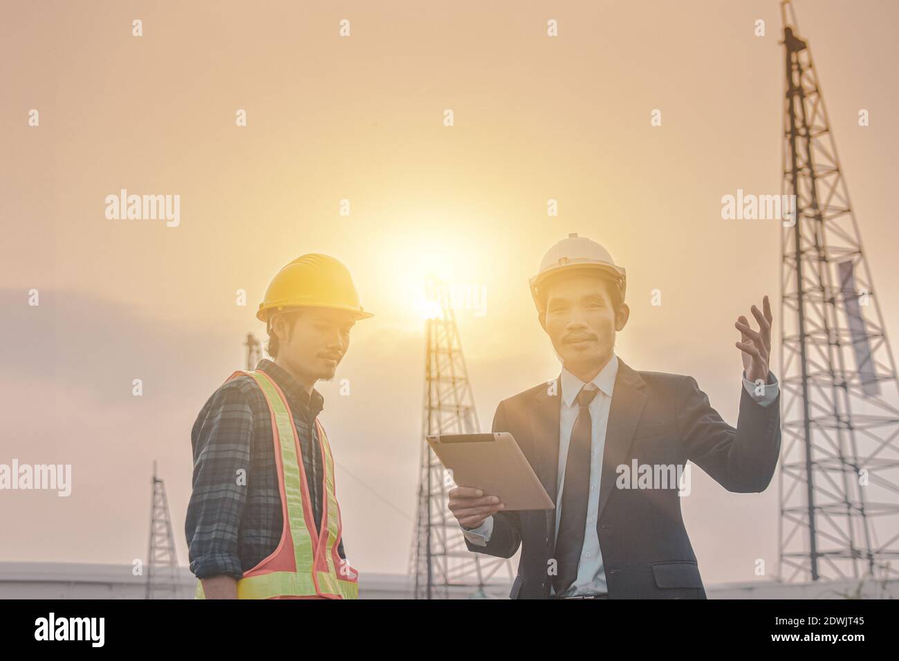 Project manager and Engineer standing communication at workplace ...