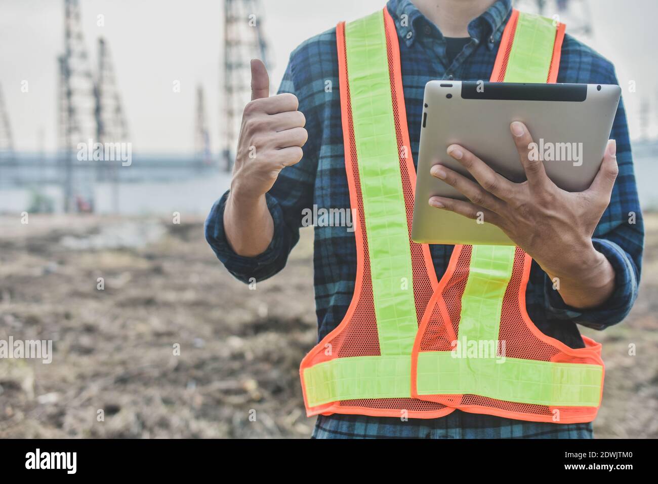 Close up Construction Engineering holding tablet building estate ...