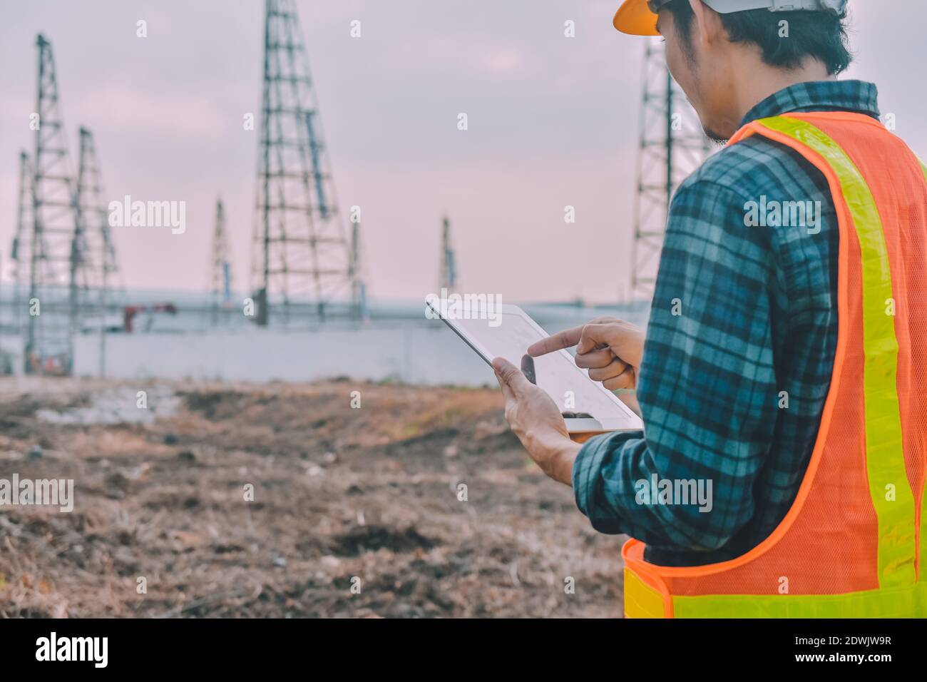 Engineer holding tablet working inspection building construction Stock ...