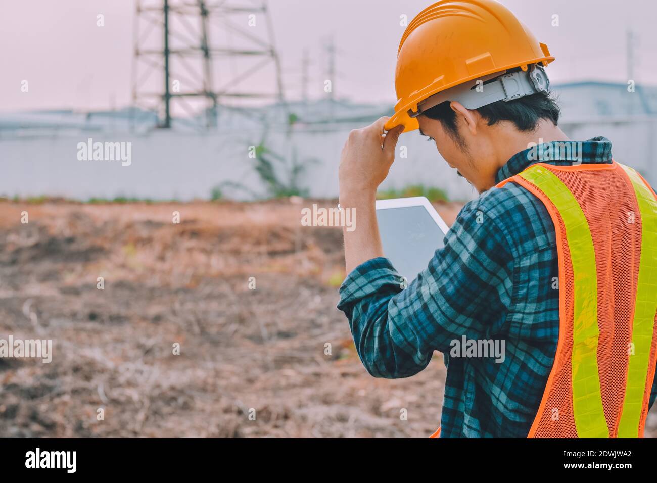 Engineer holding tablet working inspection building construction Stock ...