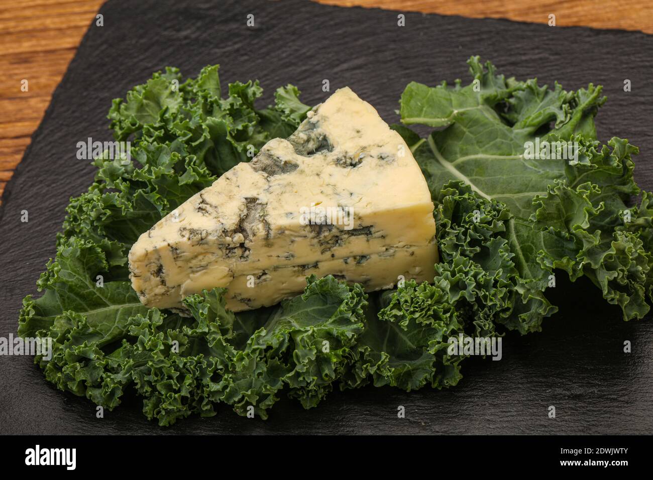 Dairy Blue cheese triangle with mold Stock Photo - Alamy
