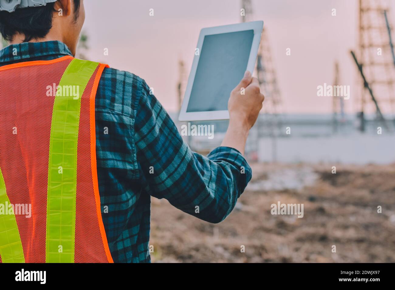 Engineer holding tablet working inspection building construction Stock ...