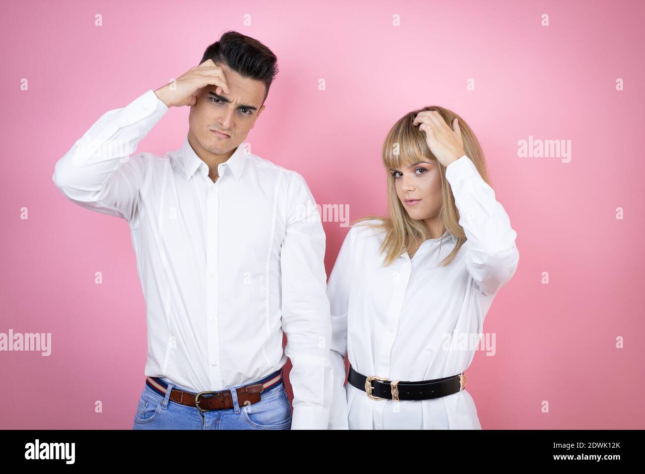 Young couple of girlfriend and boyfriend over isolated pink background ...