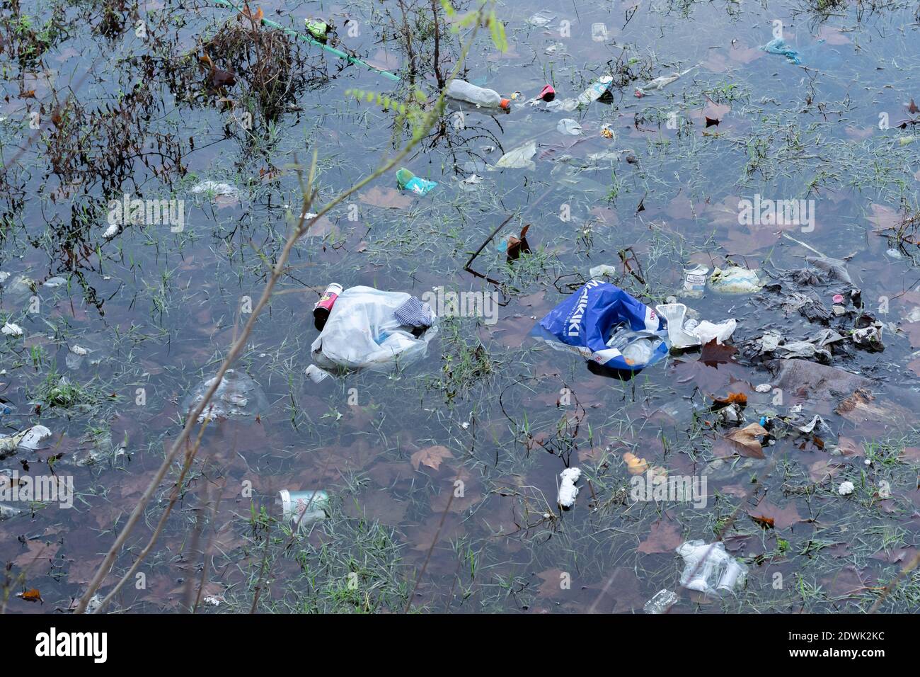 Trash thrown away in water, environmental problems. Nature disaster ...