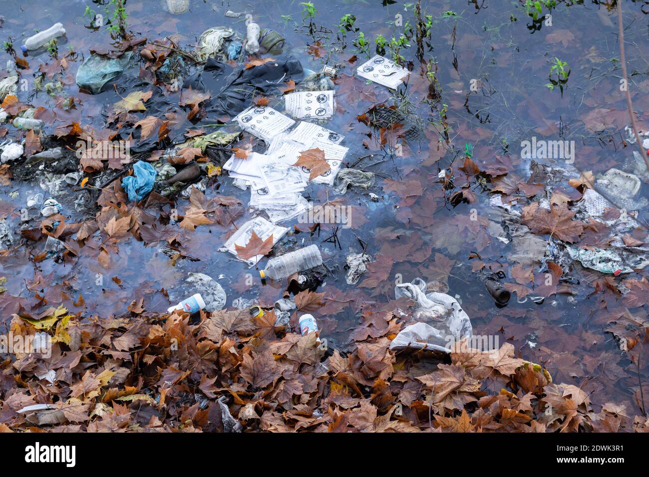 Trash thrown away in water, environmental problems. Nature disaster ...