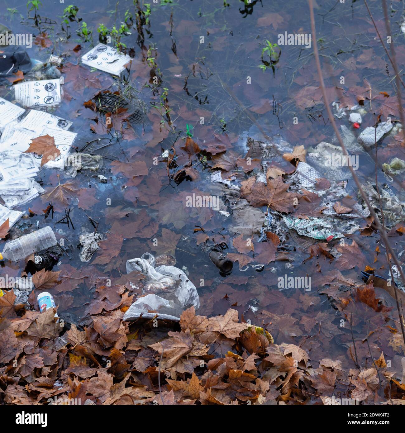 Trash thrown away in water, environmental problems. Nature disaster ...