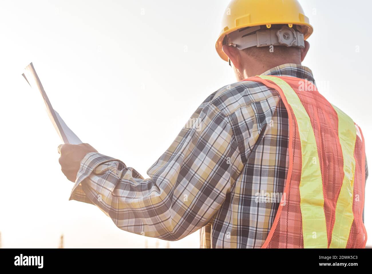 Senior Engineer Checking blueprint construction control management ...