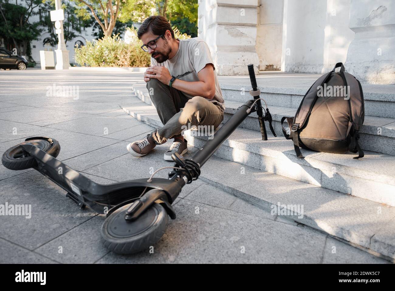 Young Man Accident With An Electric Scooter On Street. A man fell from ...