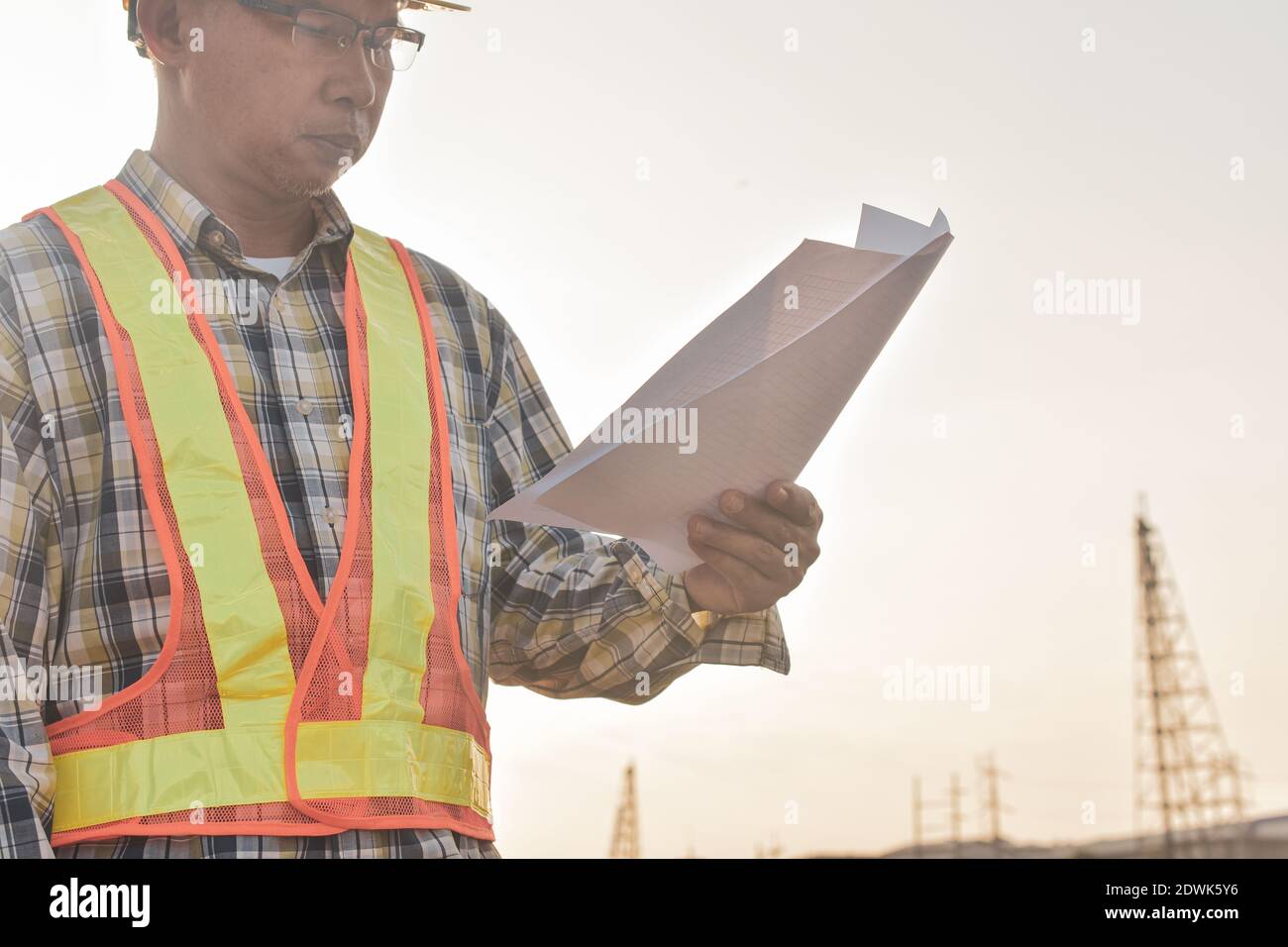 Engineer construction holding paper blueprint inspection building ...