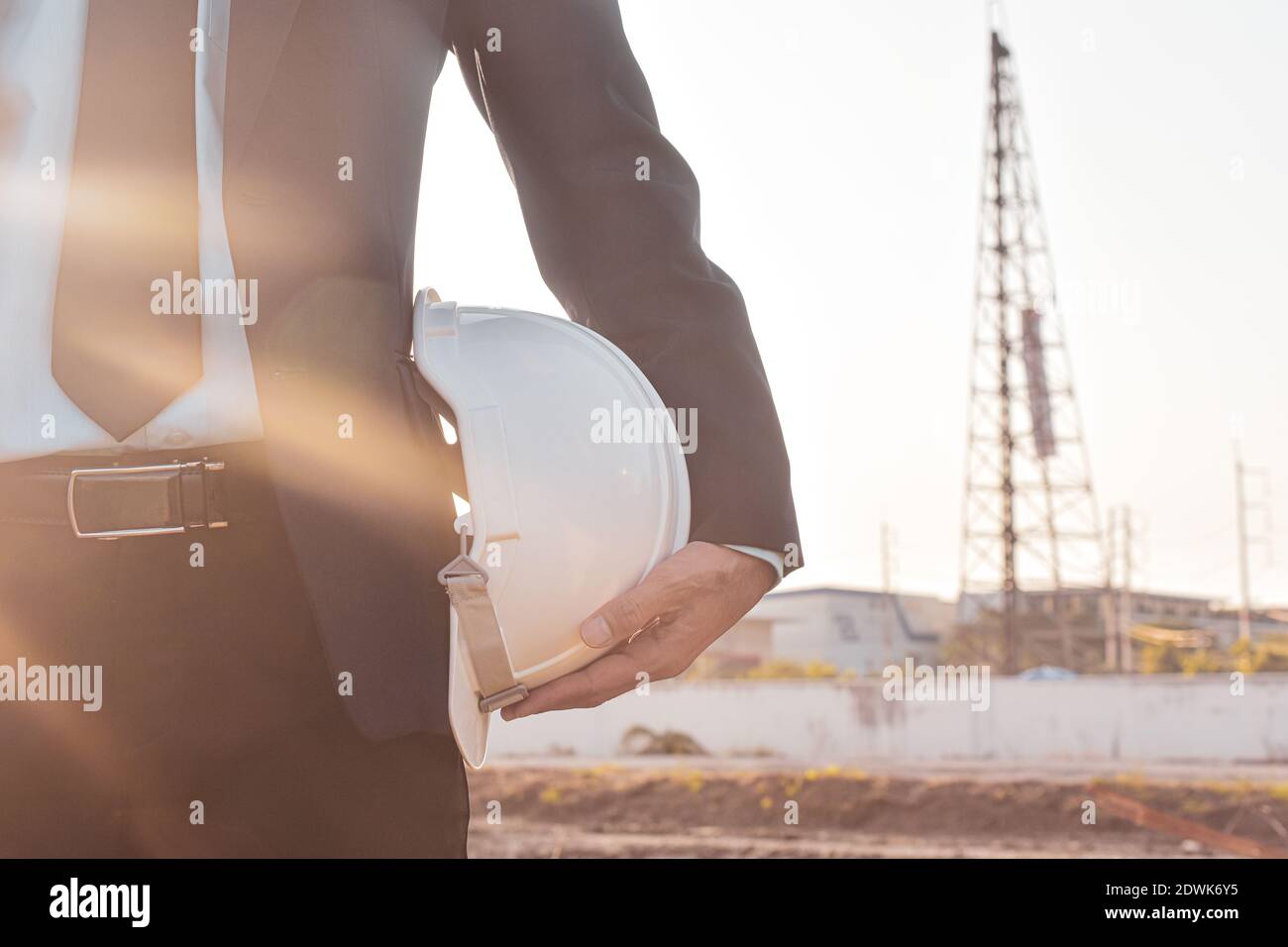 Manager holding helmet safety at building construction site Stock Photo ...
