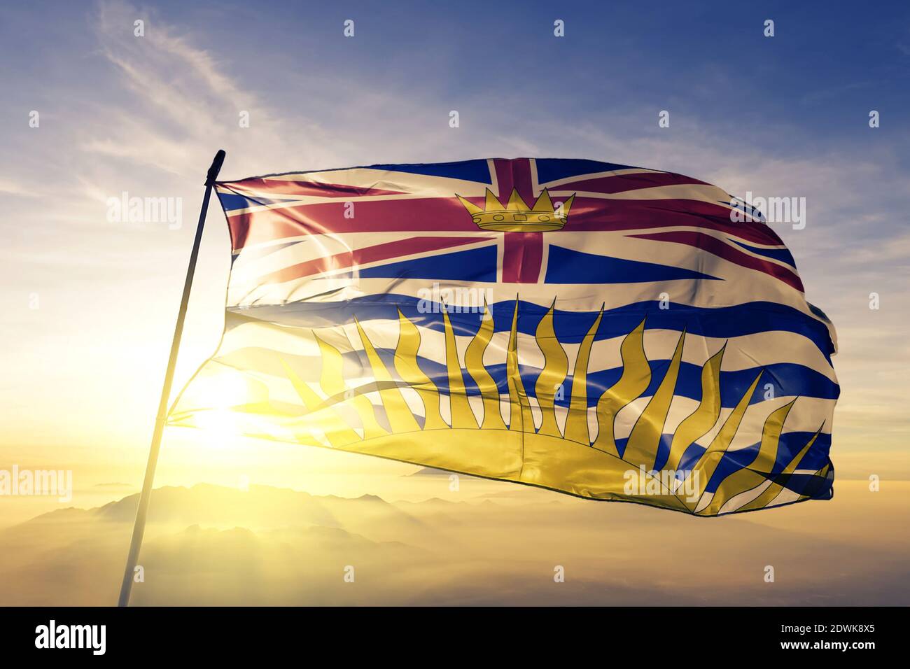British Columbia province of Canada flag waving on the top sunrise mist ...