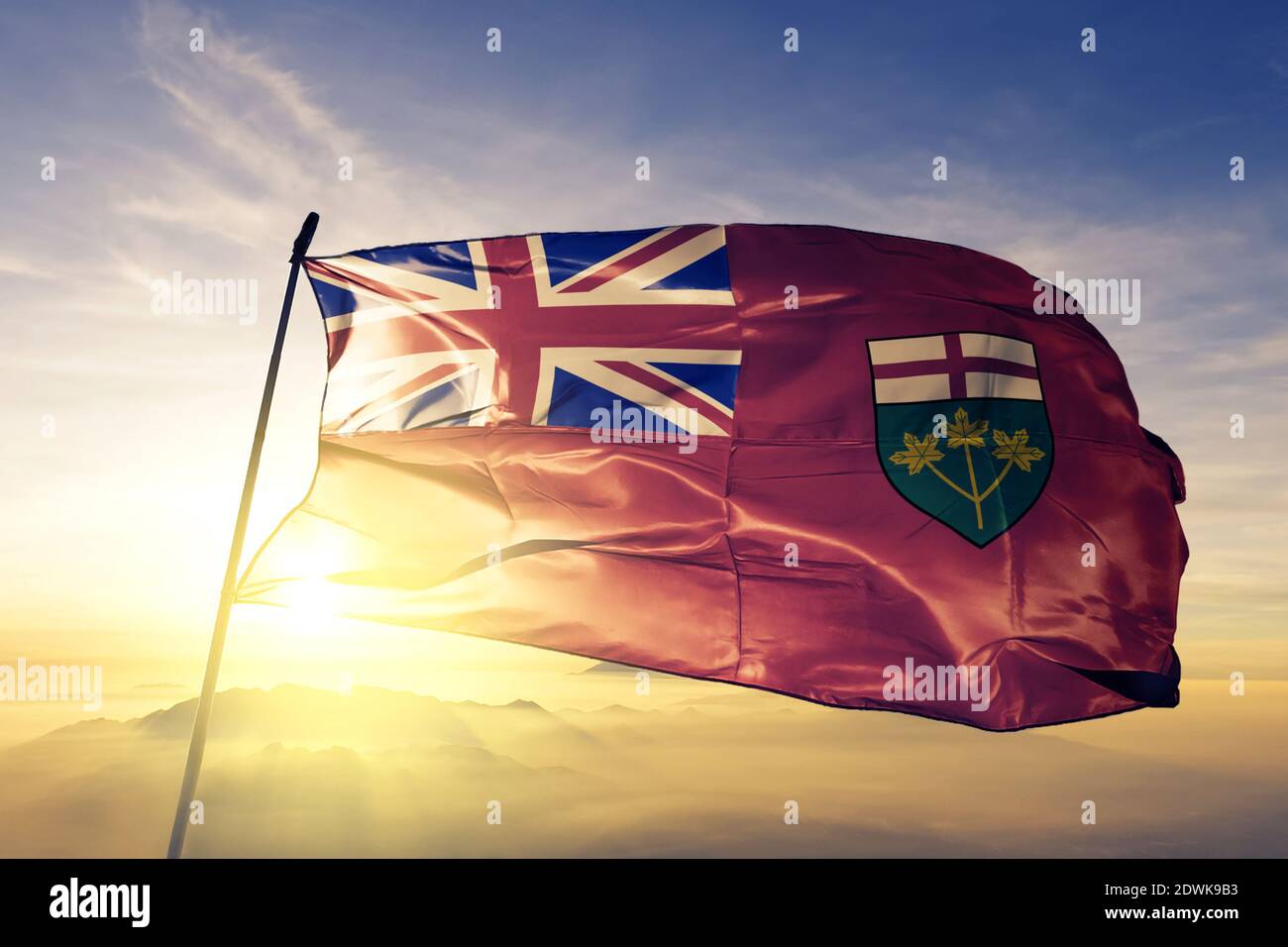 Ontario province of Canada flag waving on the top sunrise mist fog ...