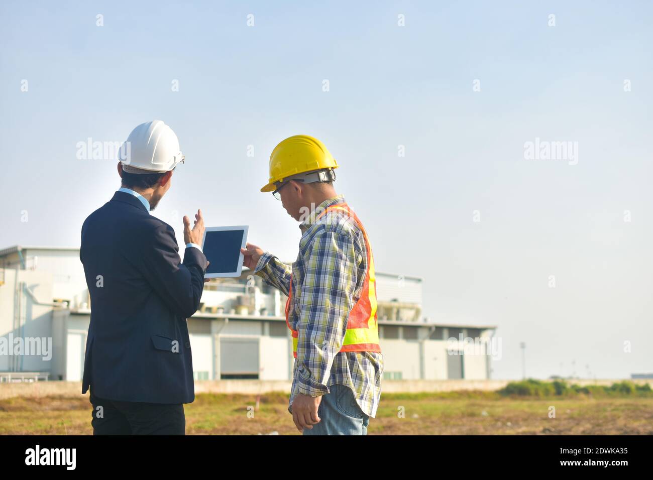 Project manager and Engineer communication use tablet factory ...