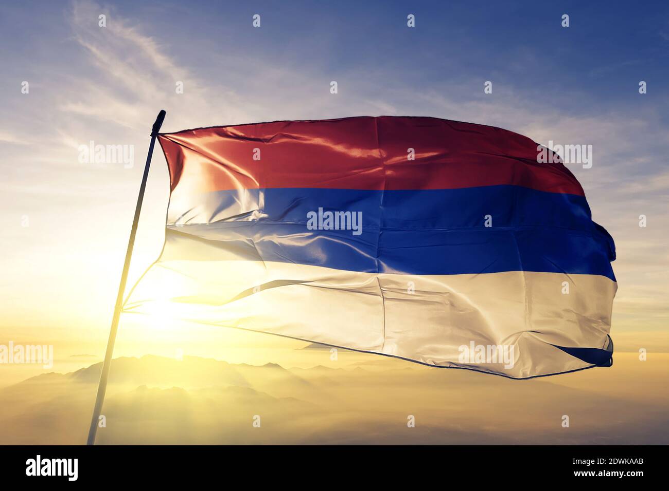 Misiones province of Argentina flag waving on the top sunrise mist fog ...