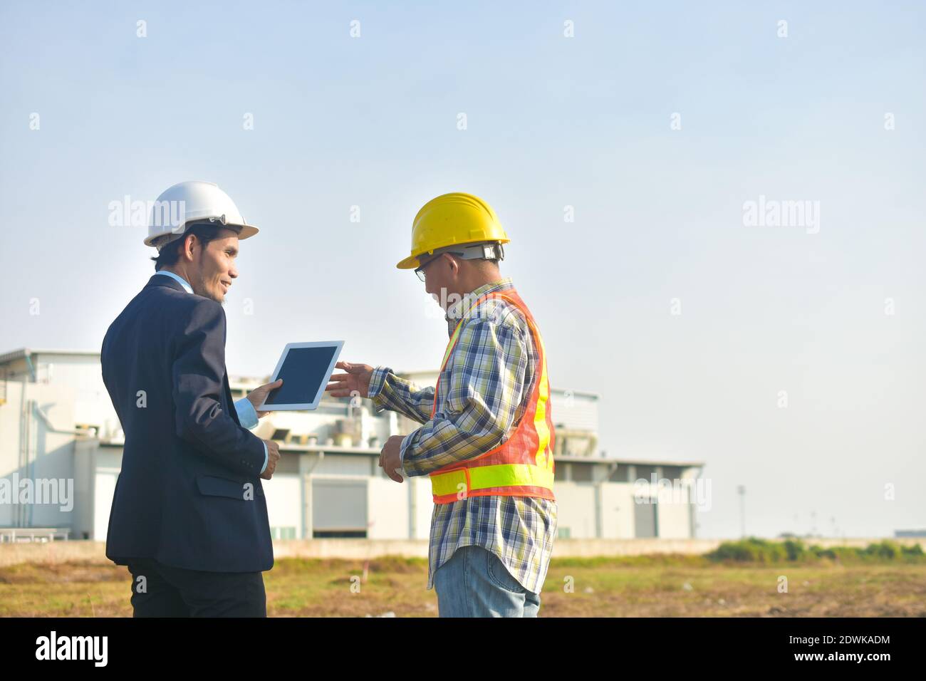 Project manager and Engineer communication use tablet factory ...