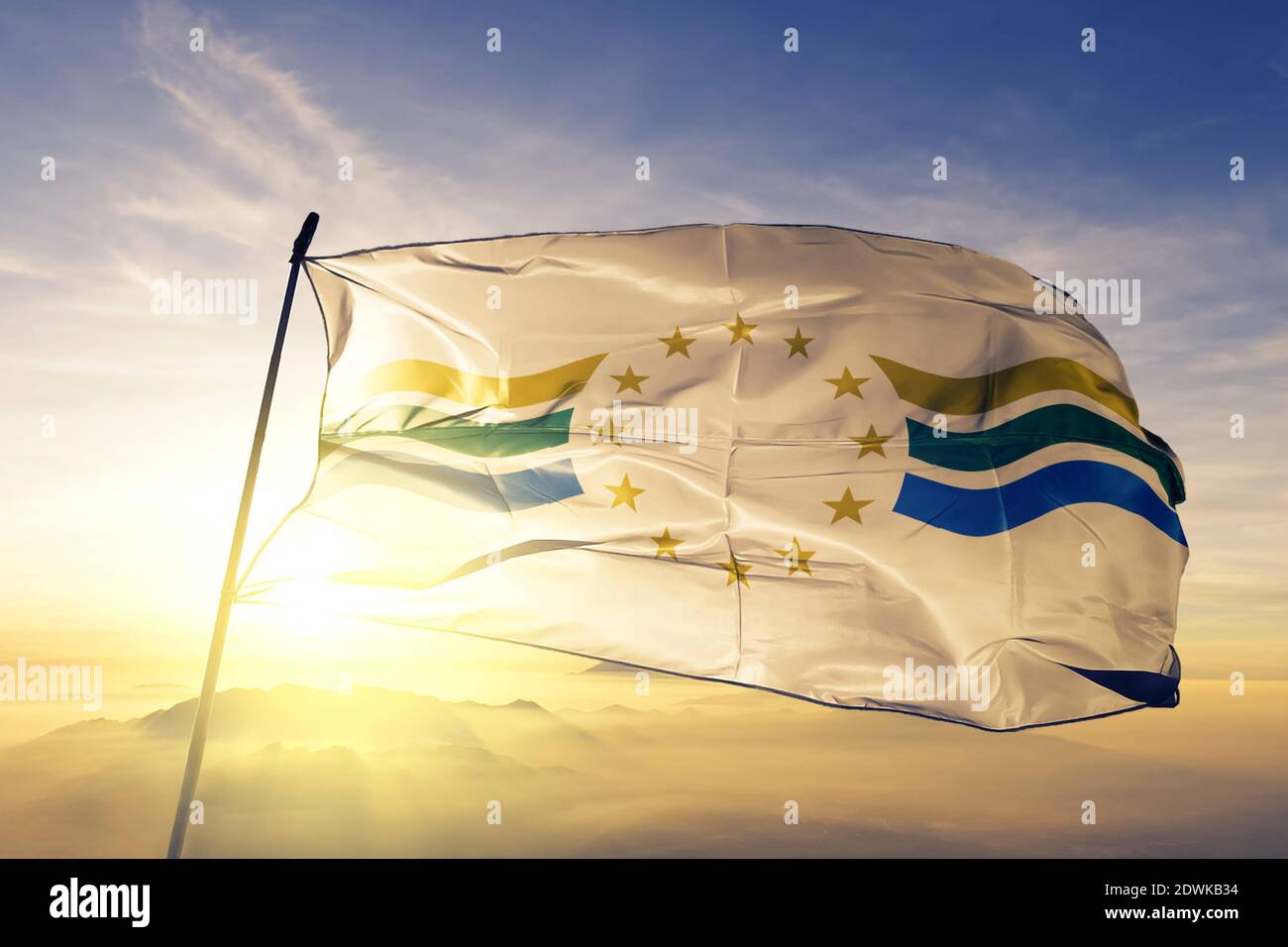 Los Rios region of Chile flag waving on the top sunrise mist fog Stock ...