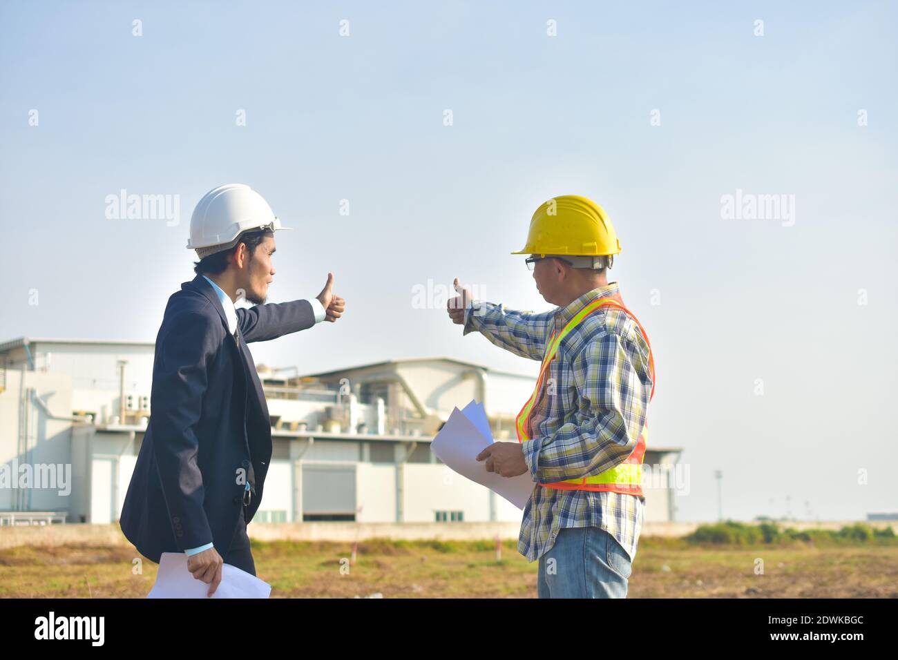 Project Manager taking with Engineer construction plan project building ...