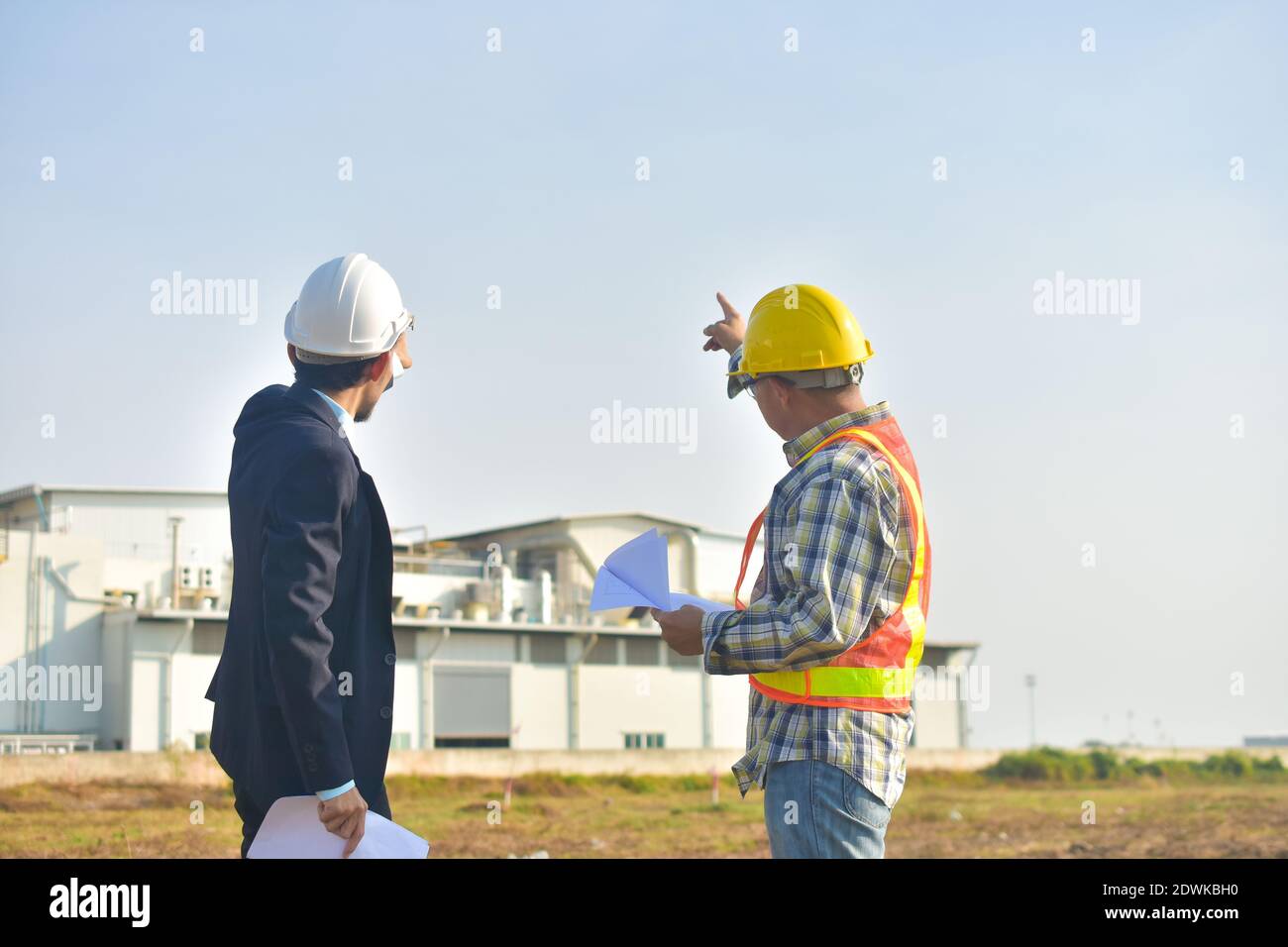 Project Manager taking with Engineer construction plan project building ...