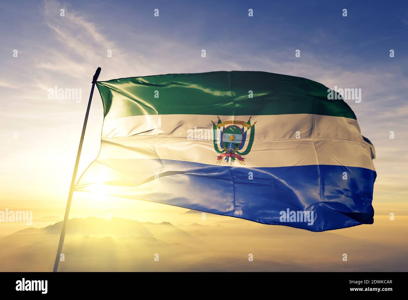 Guaviare department of Colombia flag waving on the top sunrise mist fog ...