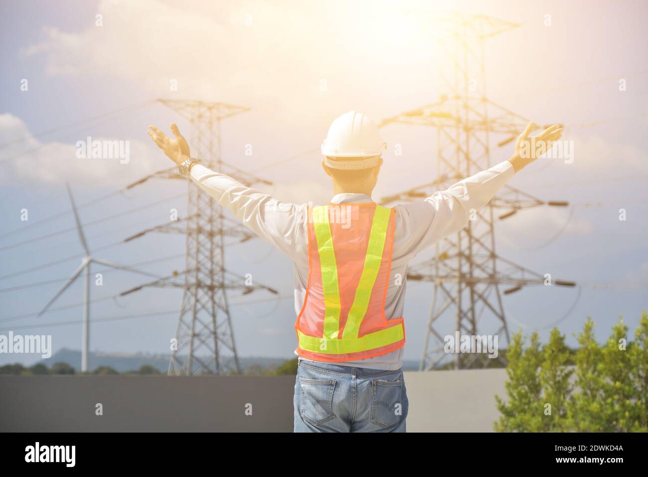 Engineering white helmet standing with high voltage line background ...