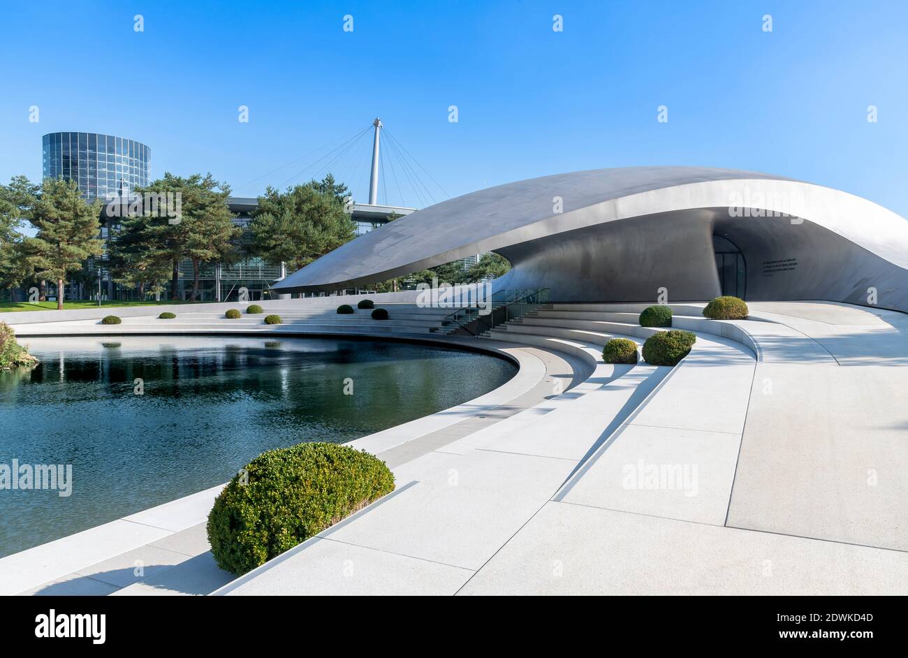 The streamlined pavilion with a curled-over steel roof for Porsche at ...