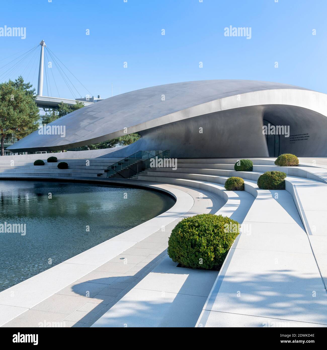 The streamlined pavilion with a curled-over steel roof for Porsche at ...