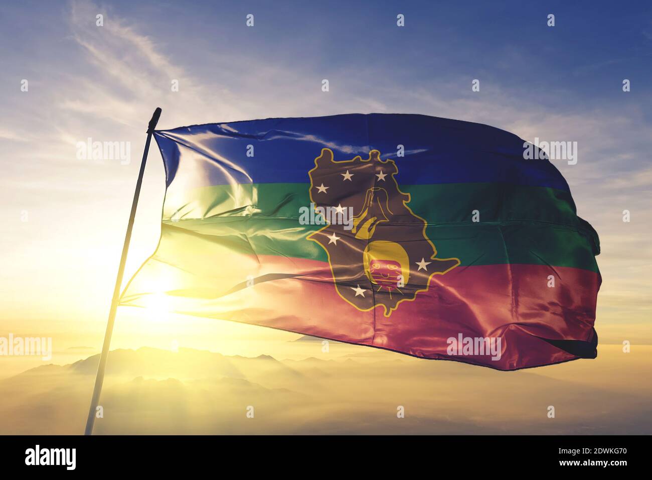 Amazonas state of Venezuela flag waving on the top sunrise mist fog ...