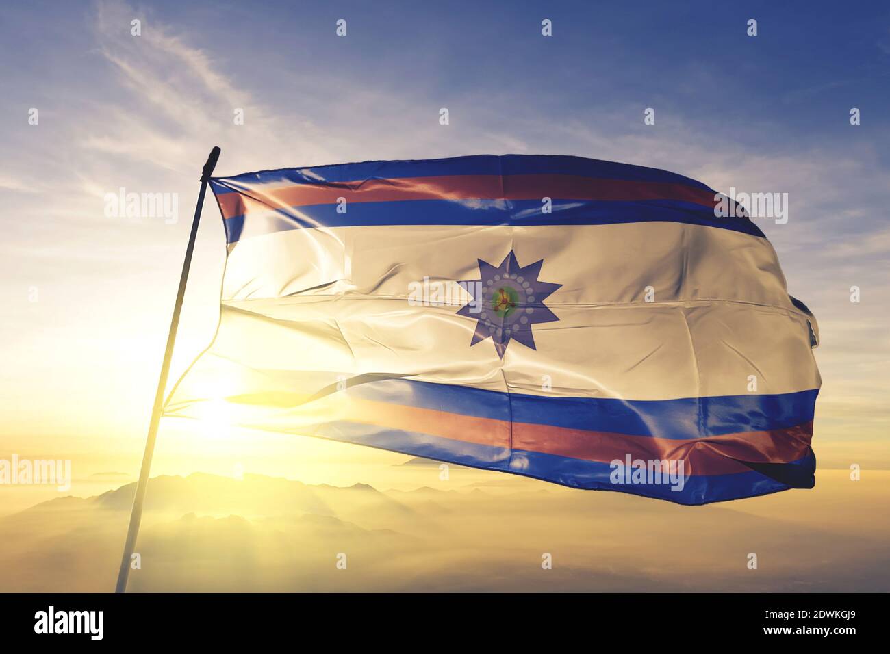 Paysandu department of Uruguay flag waving on the top sunrise mist fog ...