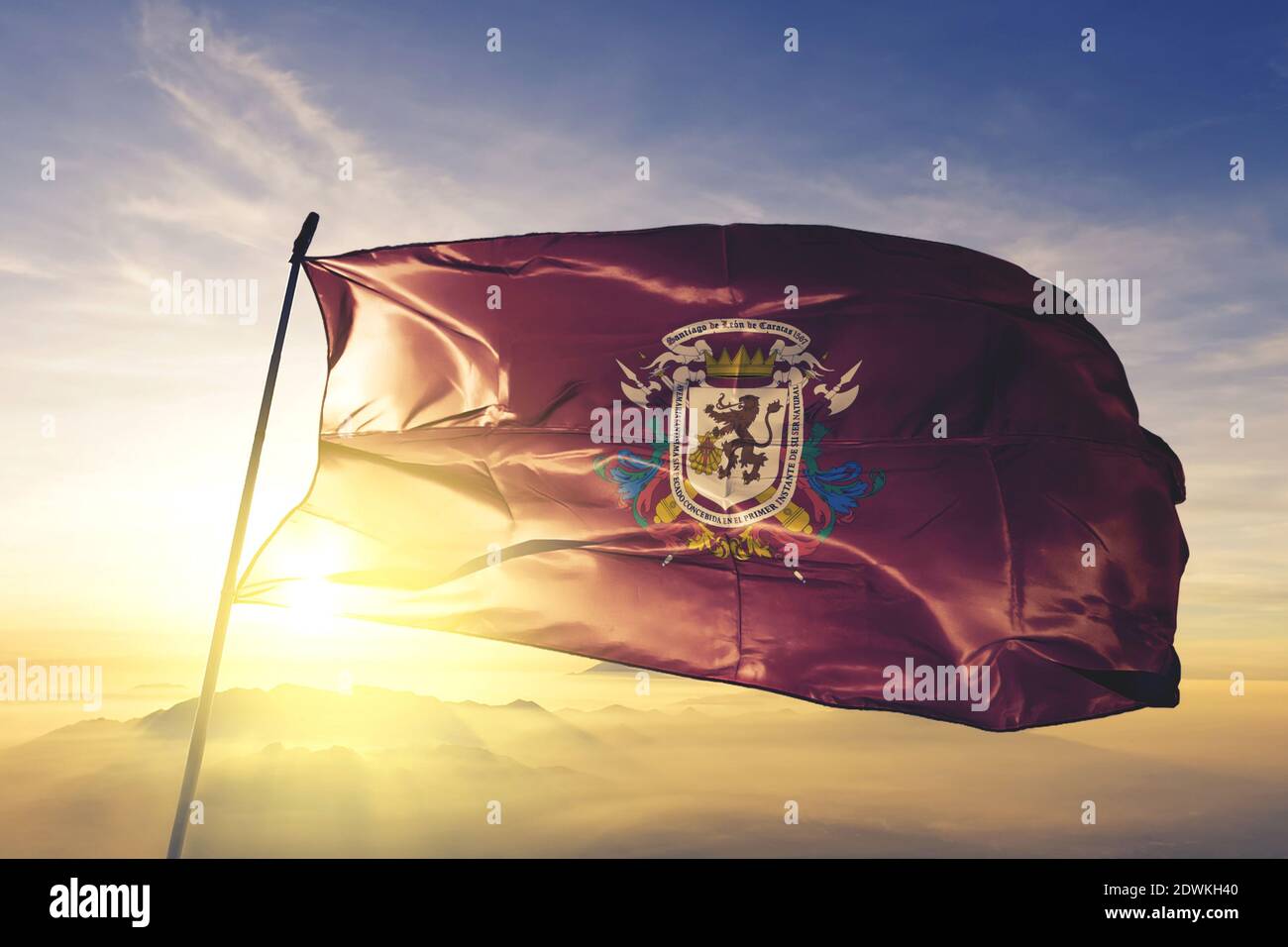Caracas capital district of Venezuela flag waving on the top sunrise ...