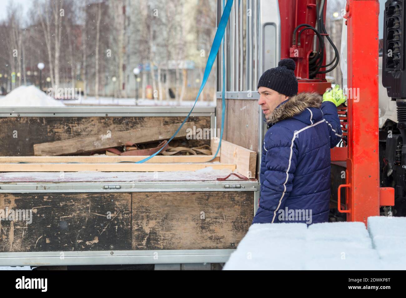 The hydraulic manipulator driver focuses on crane control Stock Photo ...