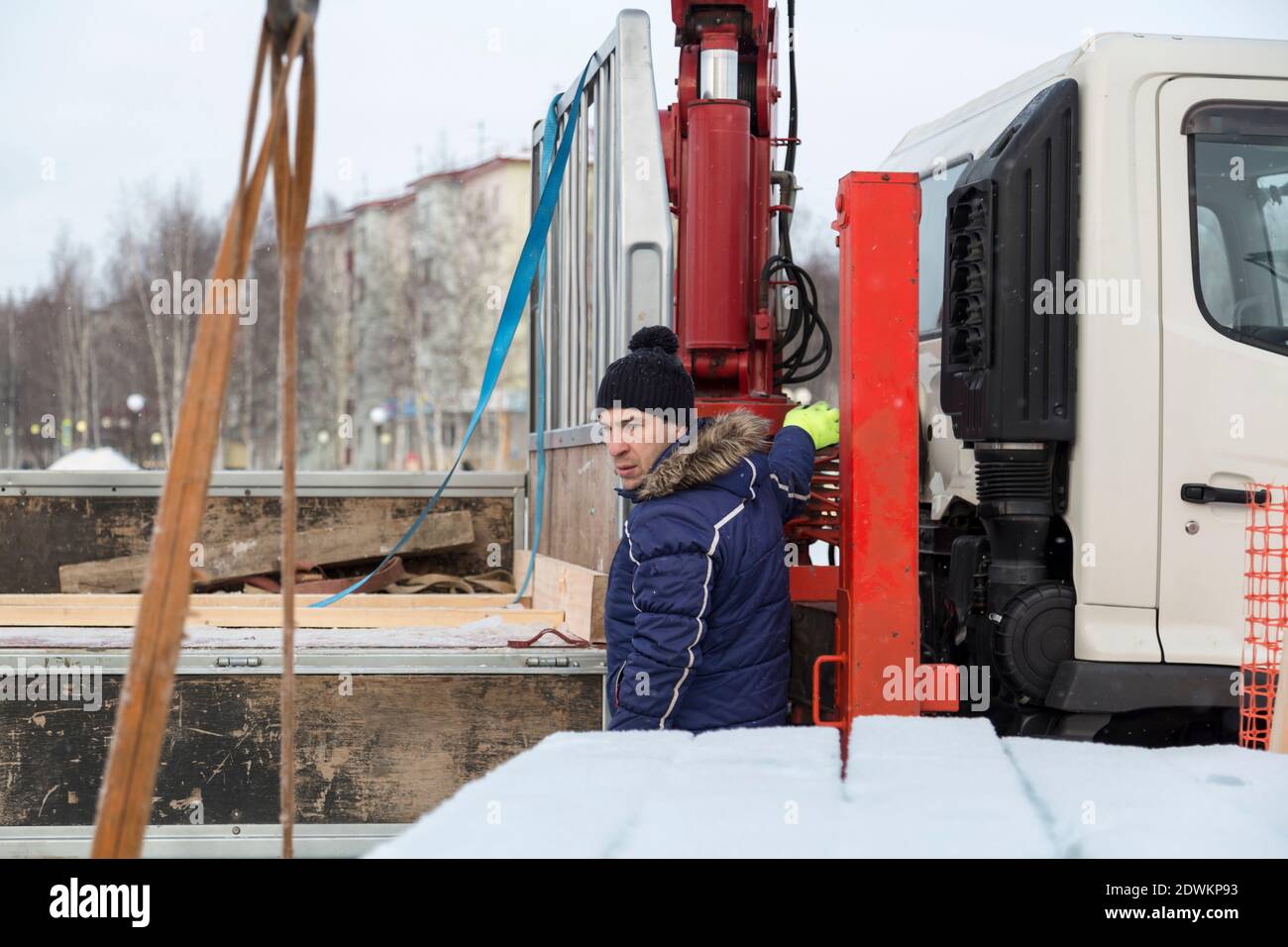 The hydraulic manipulator driver focuses on crane control Stock Photo ...