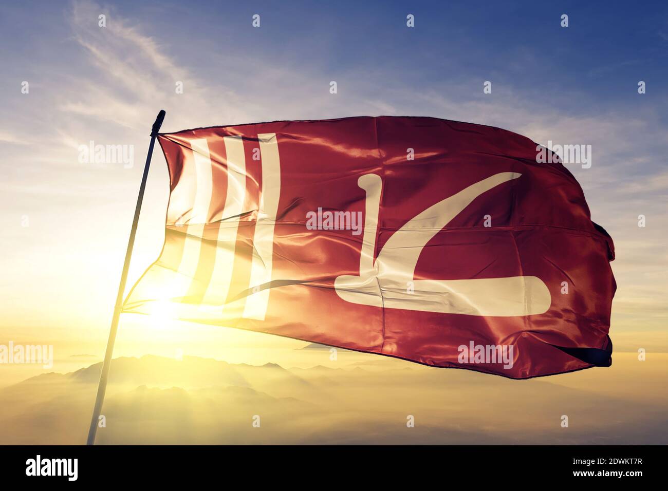 Jammu and Kashmir state of India flag waving on the top sunrise mist ...
