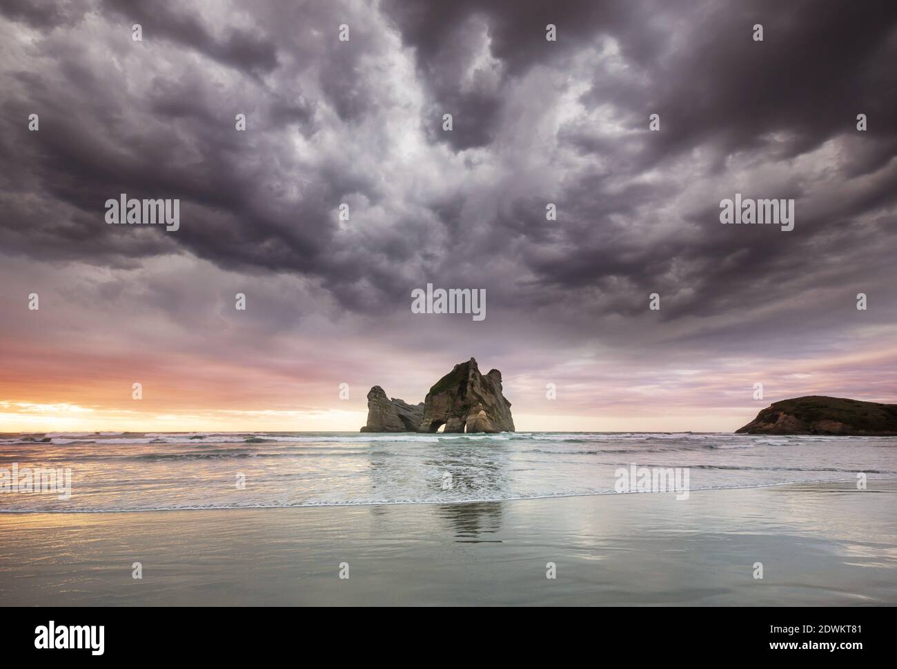 The Archway Islands of Wharariki Beach at sunset in New Zealand Stock Photo - Alamy