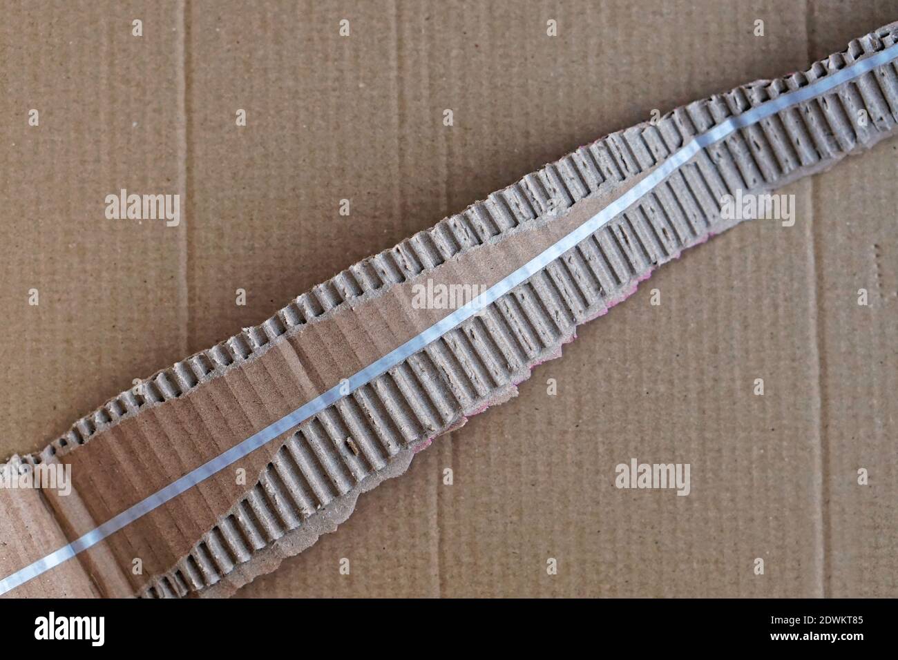 Easy to open strip at cardboard box package Stock Photo - Alamy